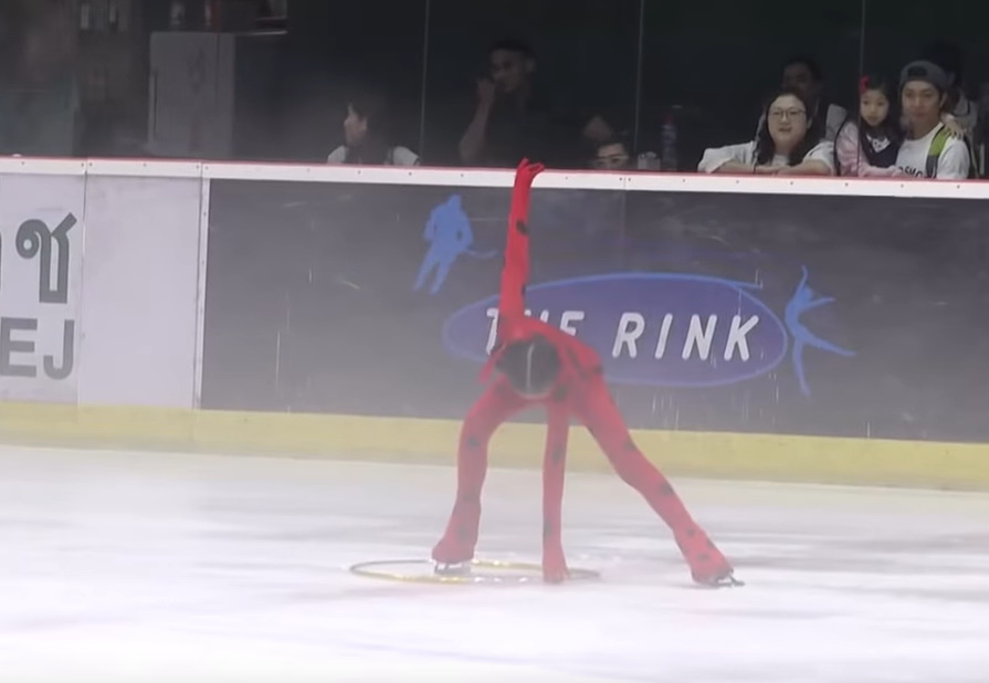 Young Skater Enters Ice With Hula Hoop And Dressed As A Ladybug