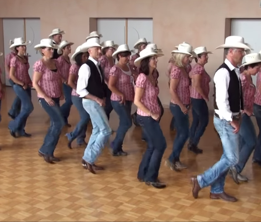 Dancers Light Up Floor With Fun Line Dance