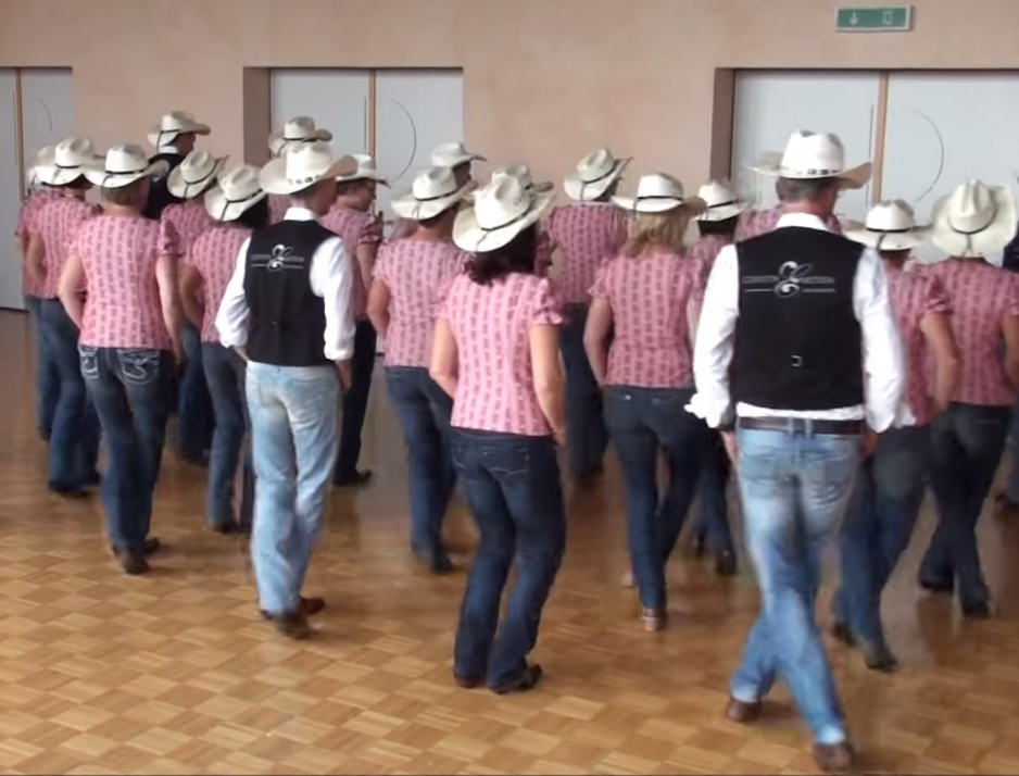 Dancers Light Up Floor With Fun Line Dance