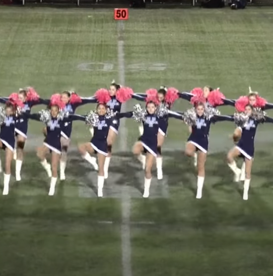 Cheerleaders Mesmerize Crowd With Fast-Paced Routine