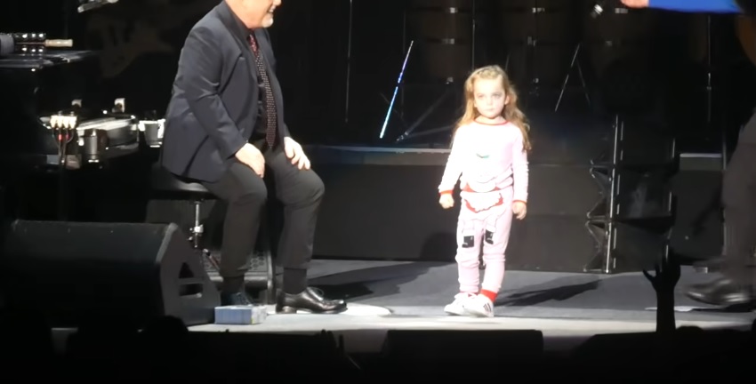 Billy Joel's 3-year old daughter shares the stage and steals his show