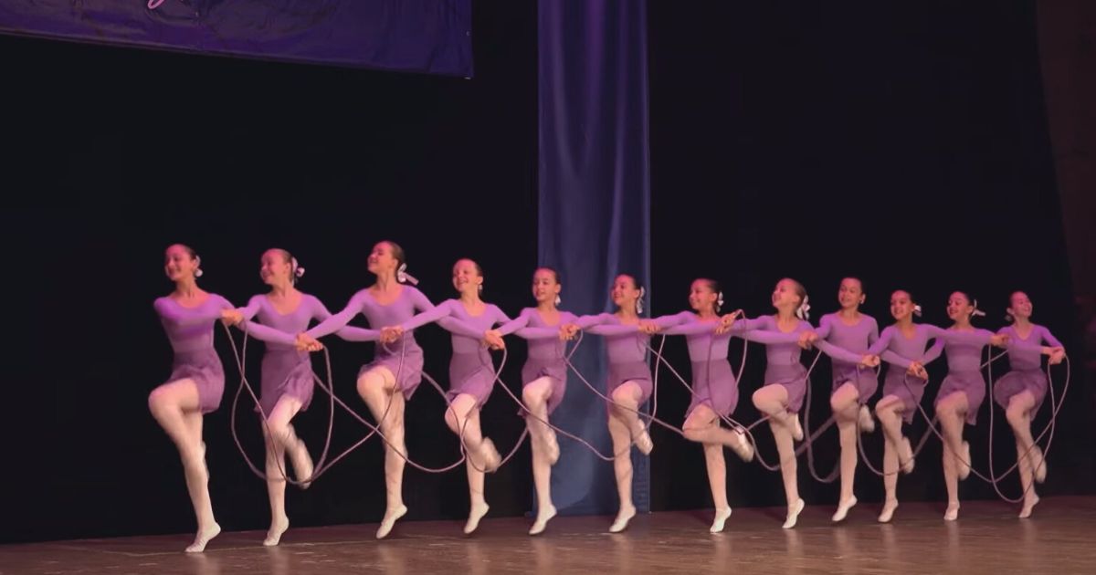 12 Young girls parade onto stage with jump ropes for different kind of ...